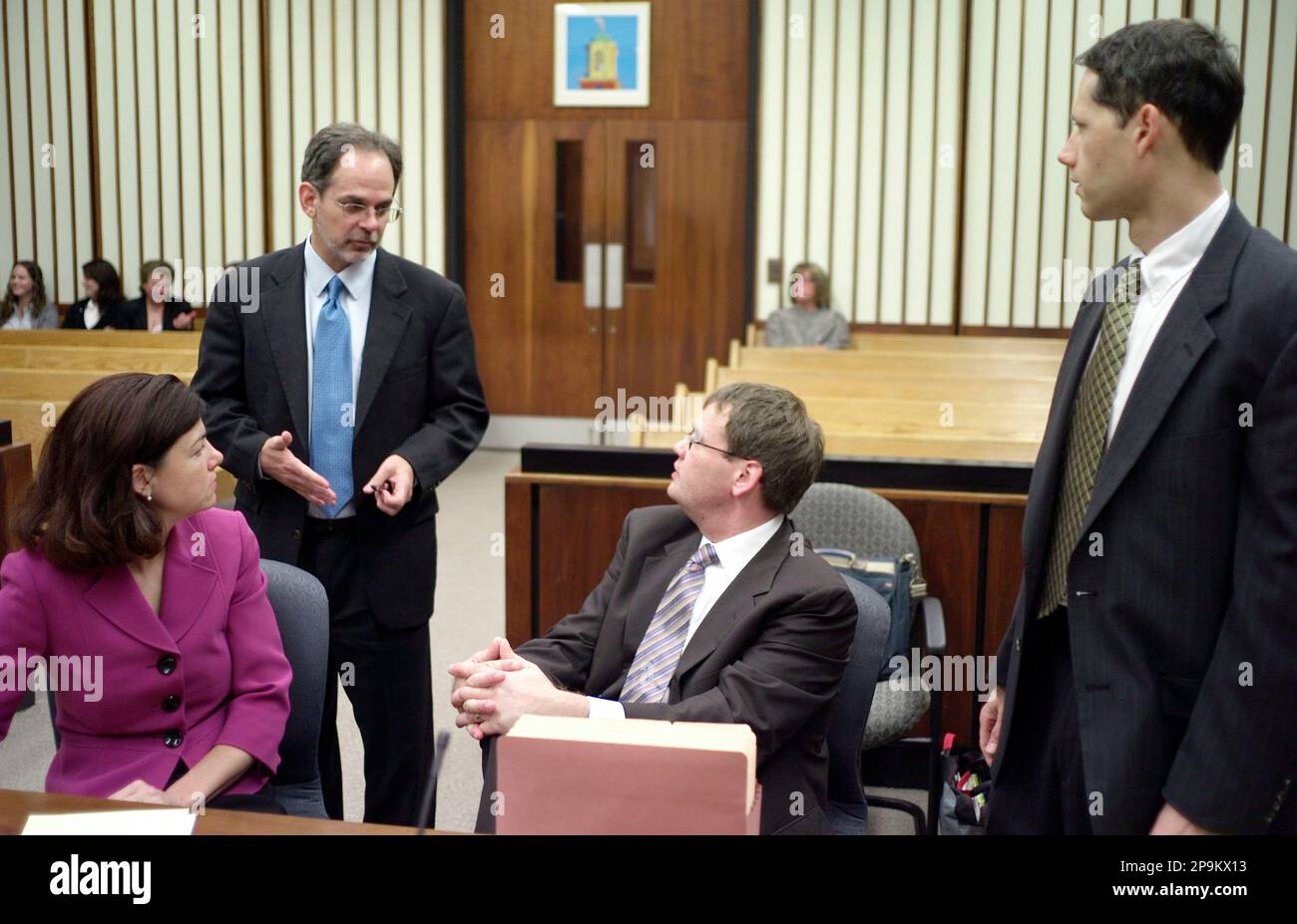 Defense lawyer Richard Guerriero,standing left, talks with, from left ...