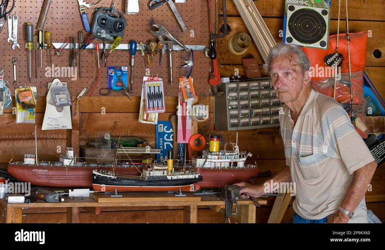 Jack East's garage workbench displays two of his handmade freighters in ...