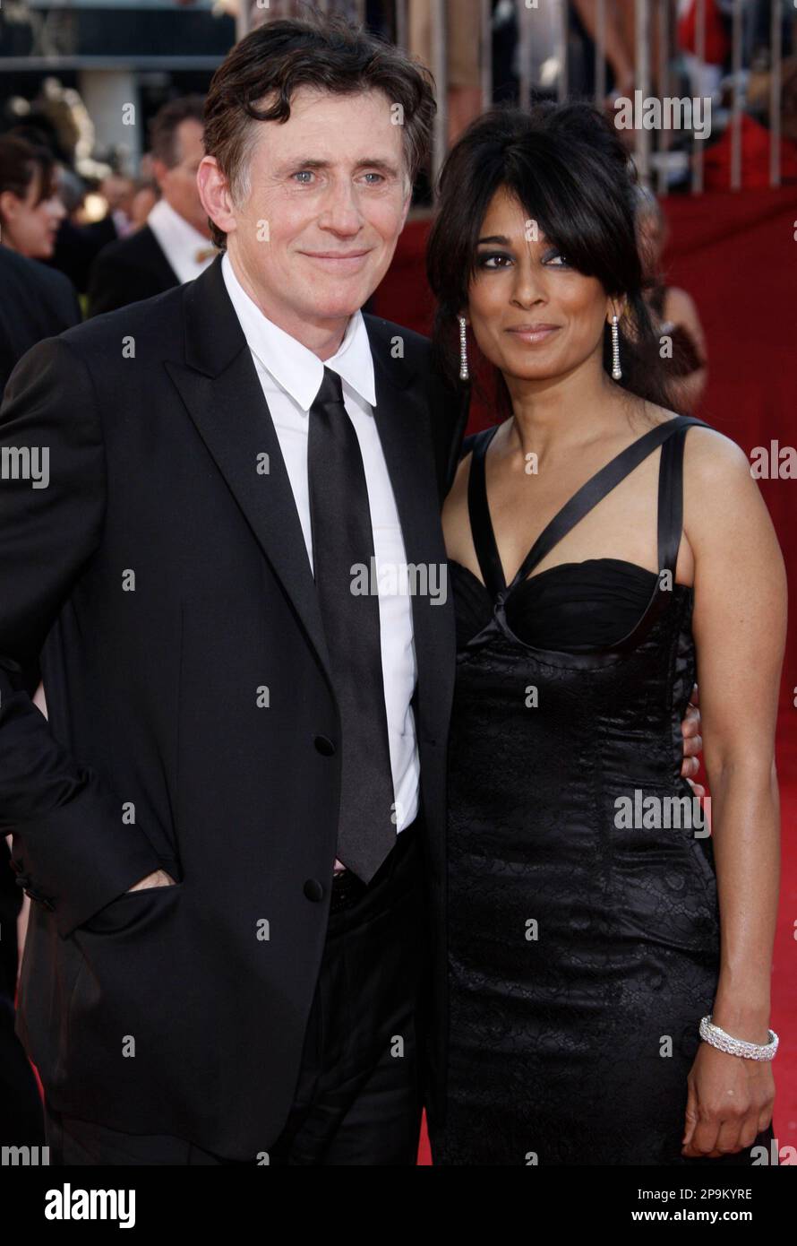 Gabriel Byrne, left, and Anna George arrive at the 60th Primetime Emmy Awards in Los Angeles ...