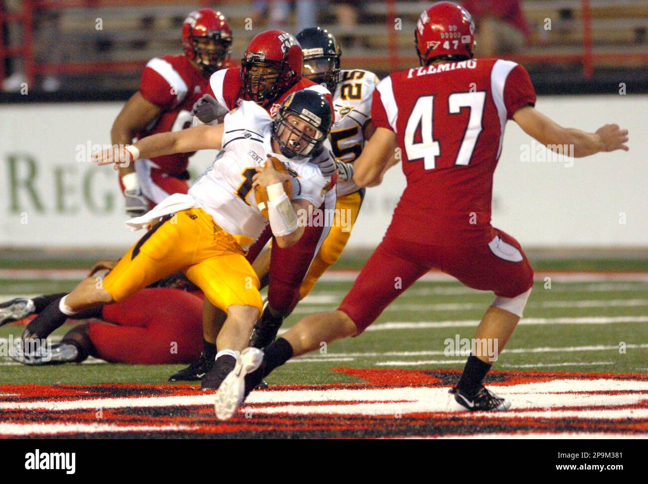 Kent State's quarterback Julian Edelman (1) his tackled by Louisiana ...