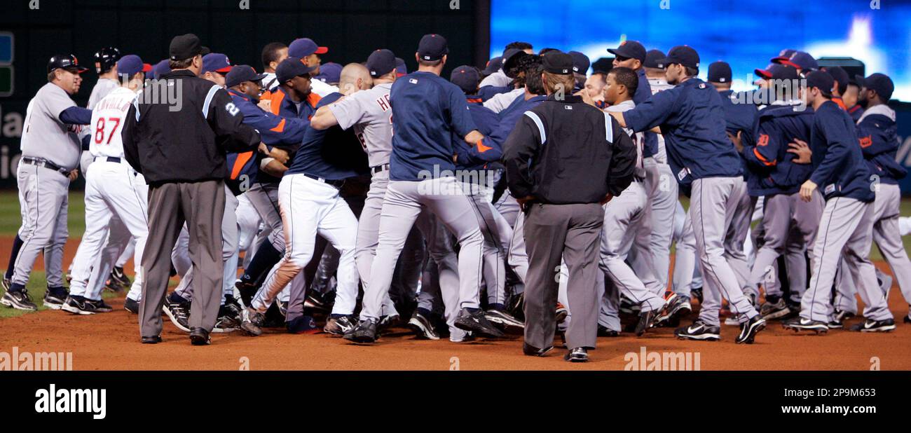 The Detroit Tigers and the Cleveland Indians fight on the field during ...