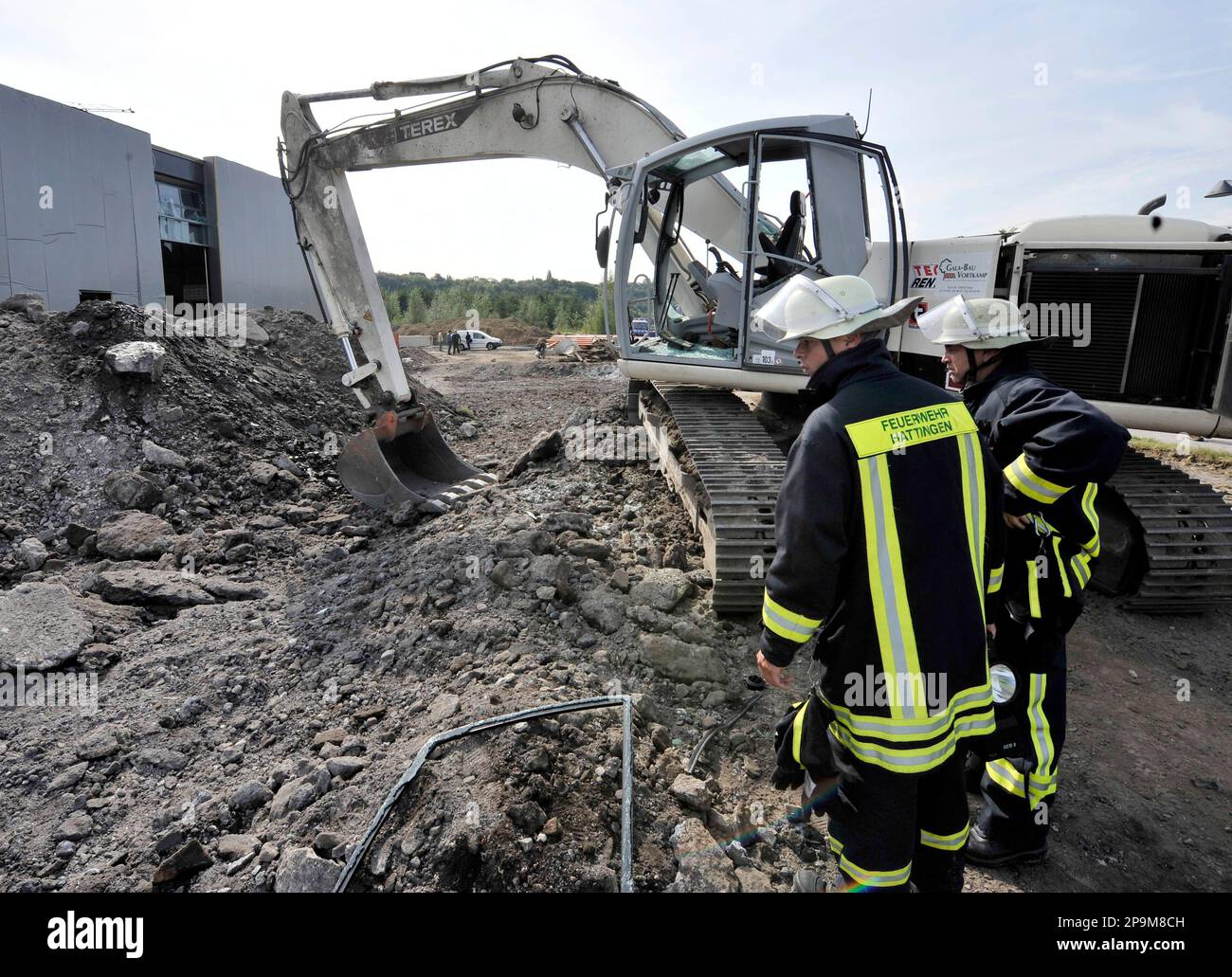 Firefighters watch a a construction site, where a bomb of World War II ...