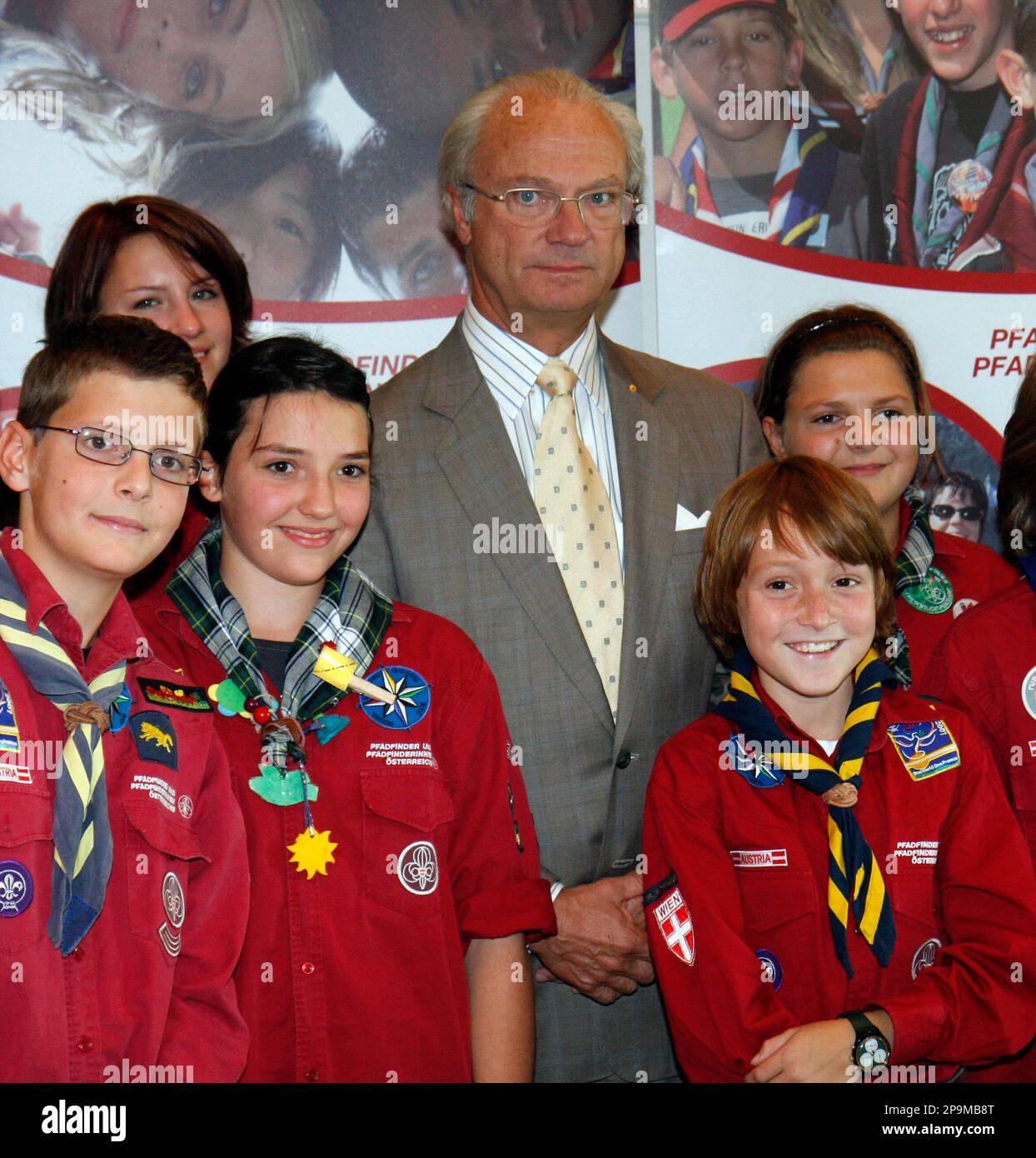 Sweden's King Carl Gustaf, center, poses with a group of scouts, during ...