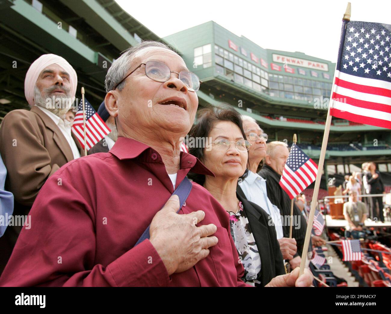 Hiep Doan, front, a resident of Boston and immigrant from Vietnam ...