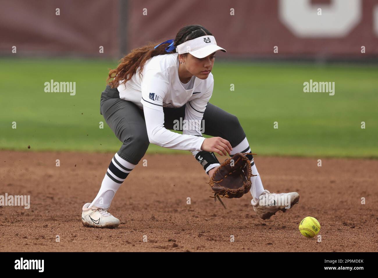 Ariel Fifita (23) of Utah State fields the ball during an NCAA softball ...