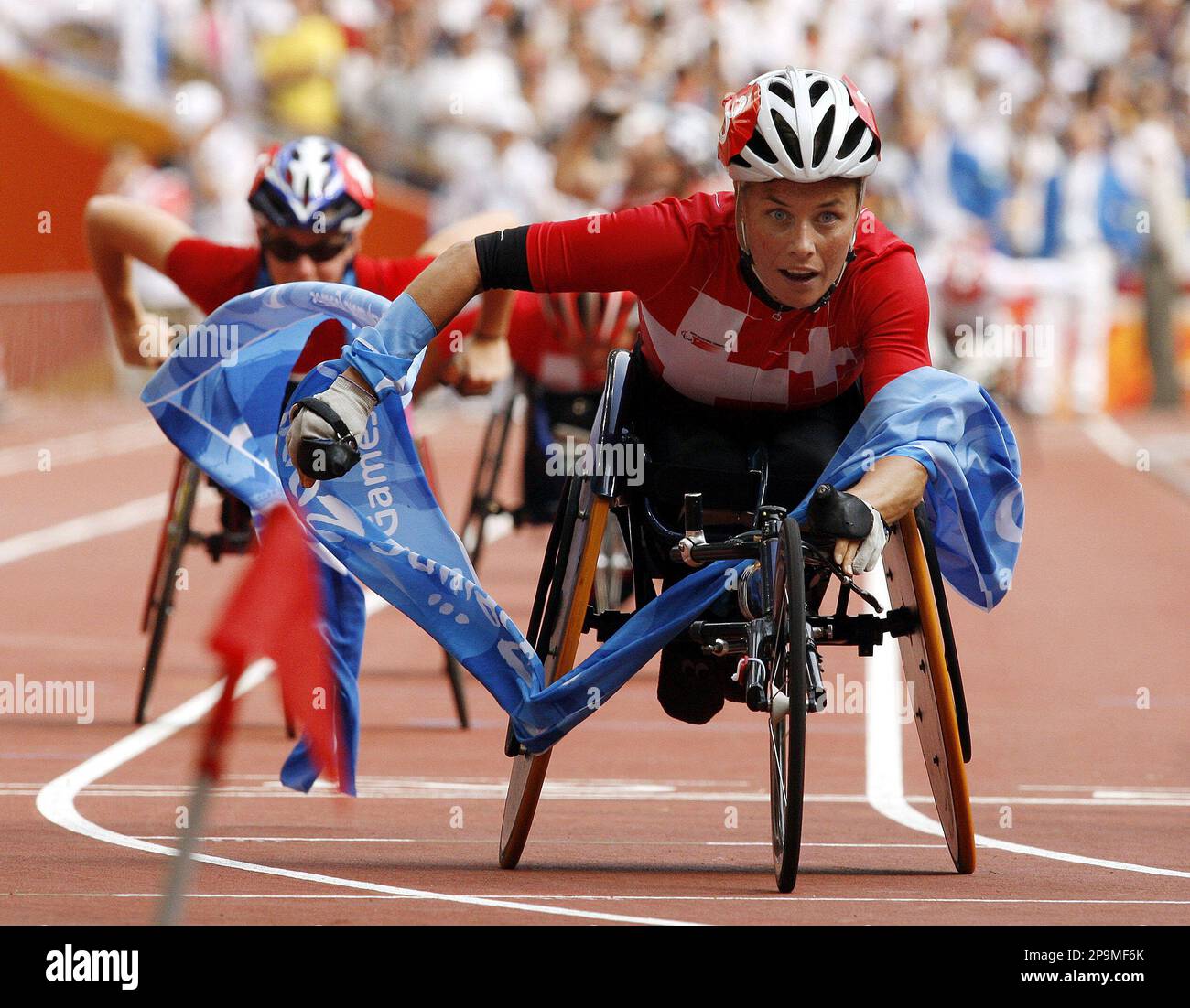 Switzerland's Edith Hunkeler crosses the line to win the gold medal in ...