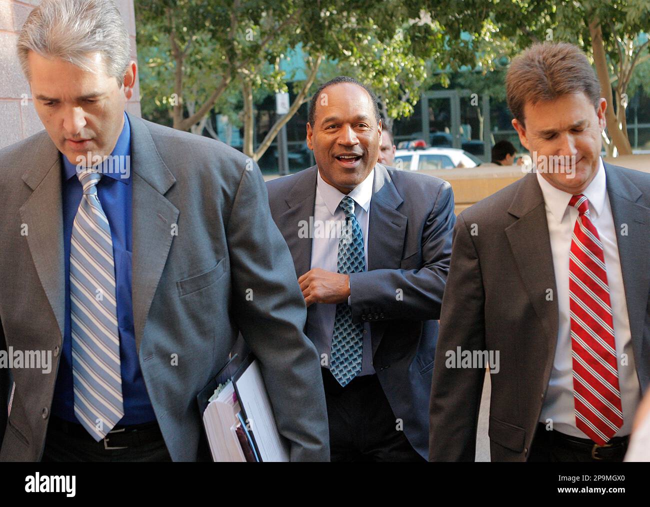 O.J. Simpson, center, his lawyers Yale Galanter, right, and Gabriel ...