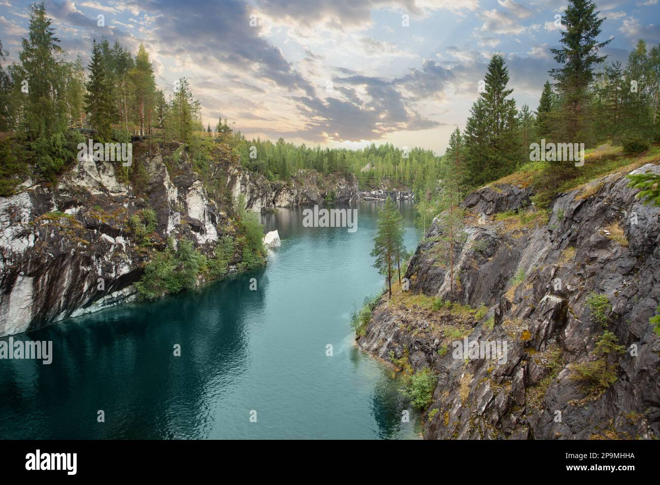 Landscape of green woods and blue mountain river Stock Photo - Alamy