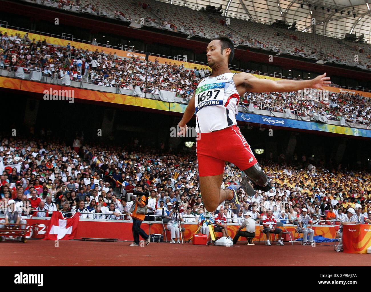 Japan's Atsushi Yamamoto jumps as he competes in the Men's Long Jump ...