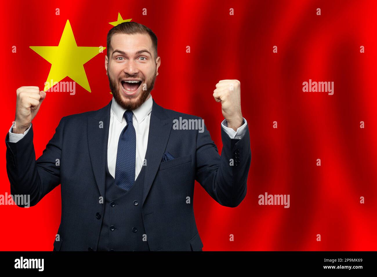 Chinese happy businessman on the background of flag of China Business ...