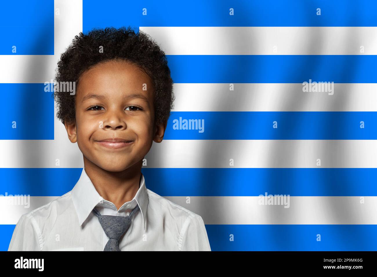Greek kid boy on flag of Greece background. Education and childhood ...