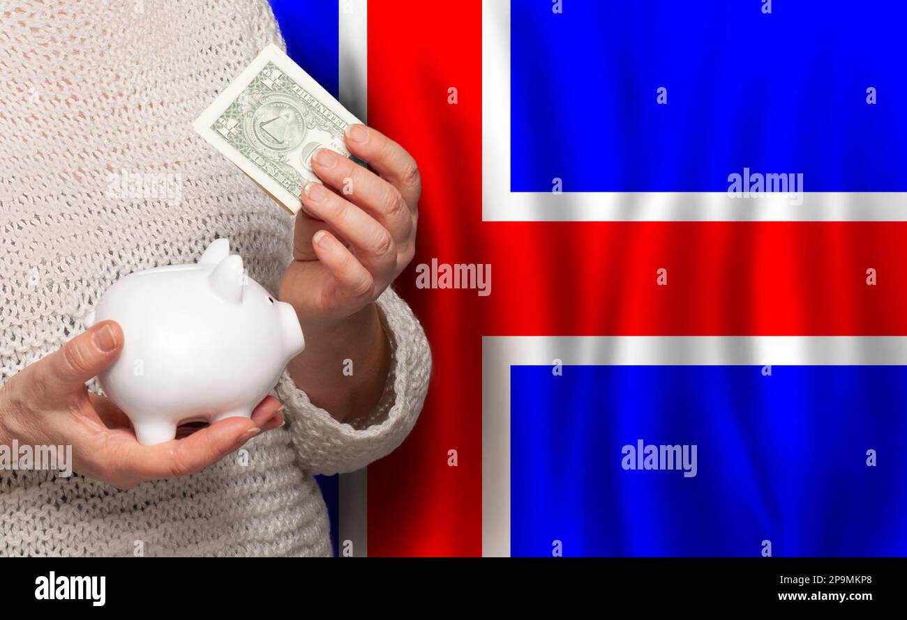 Icelandic woman with money bank on the background of Iceland flag ...