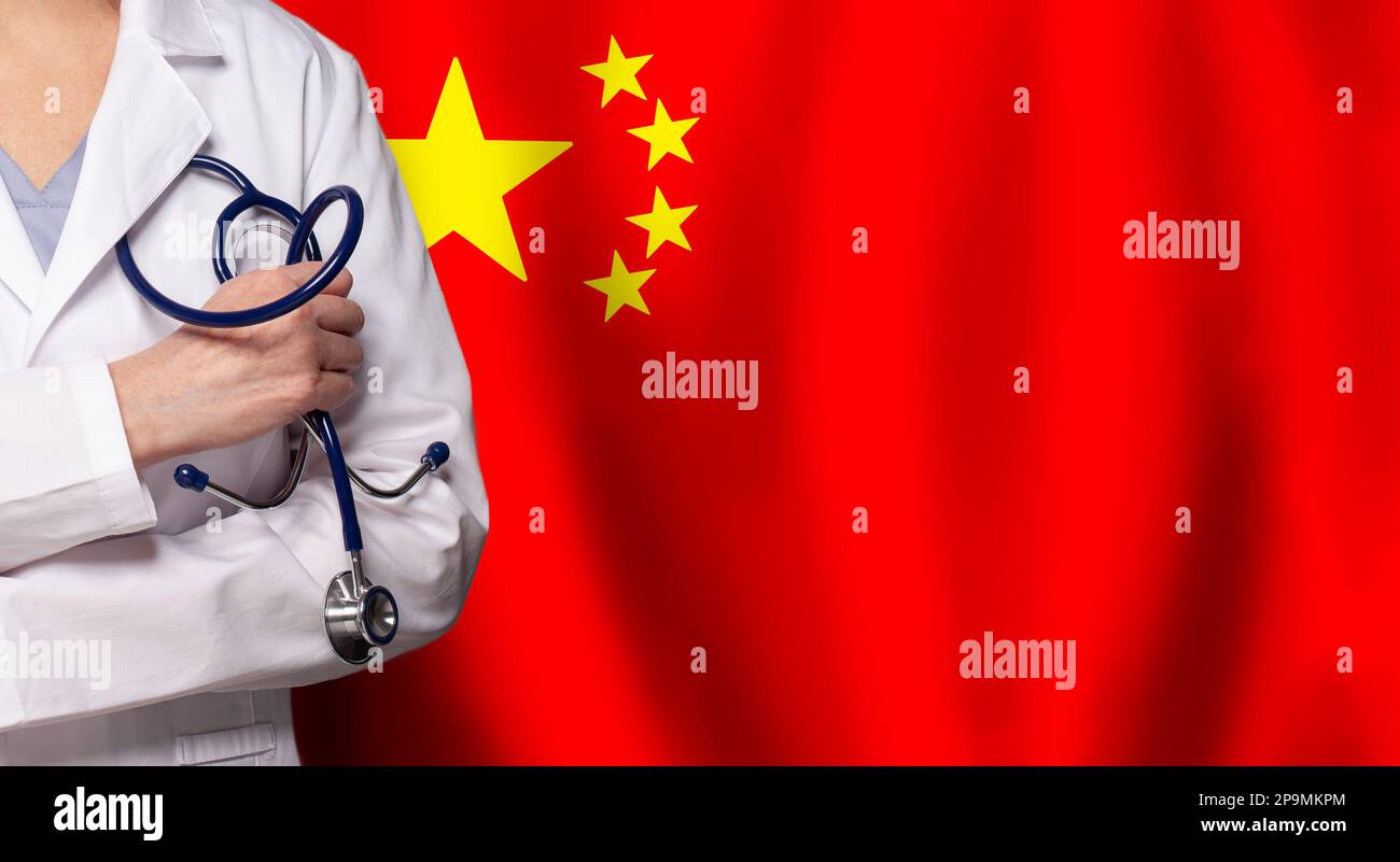 Chinese medicine and healthcare concept. Doctor close up against flag ...