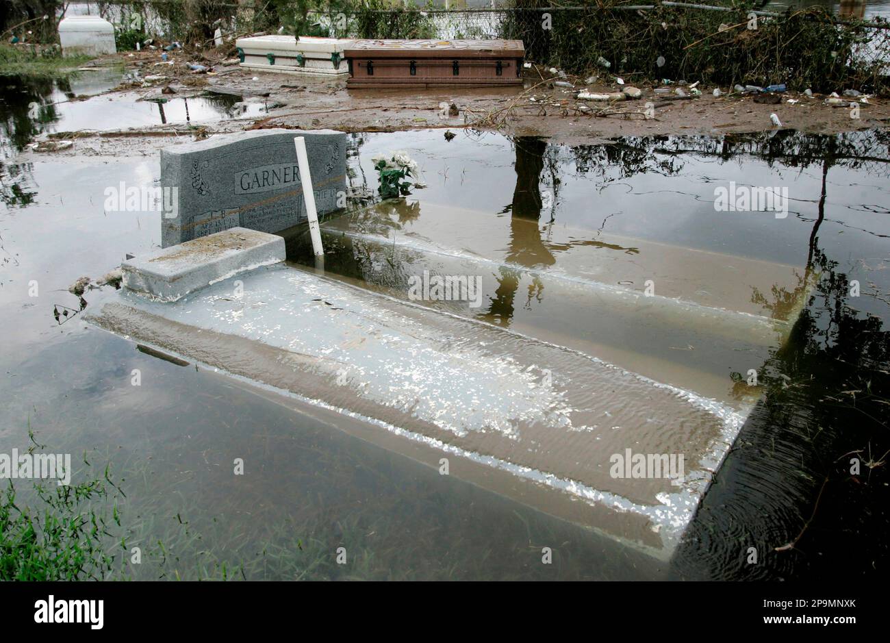 Sumbmerged tombs and floating caskets, rear, are seen at the Hollywood ...