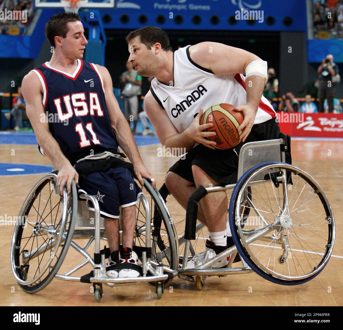 Canada's Joey Johnson, right, looks at Steve Serio of USA during their ...
