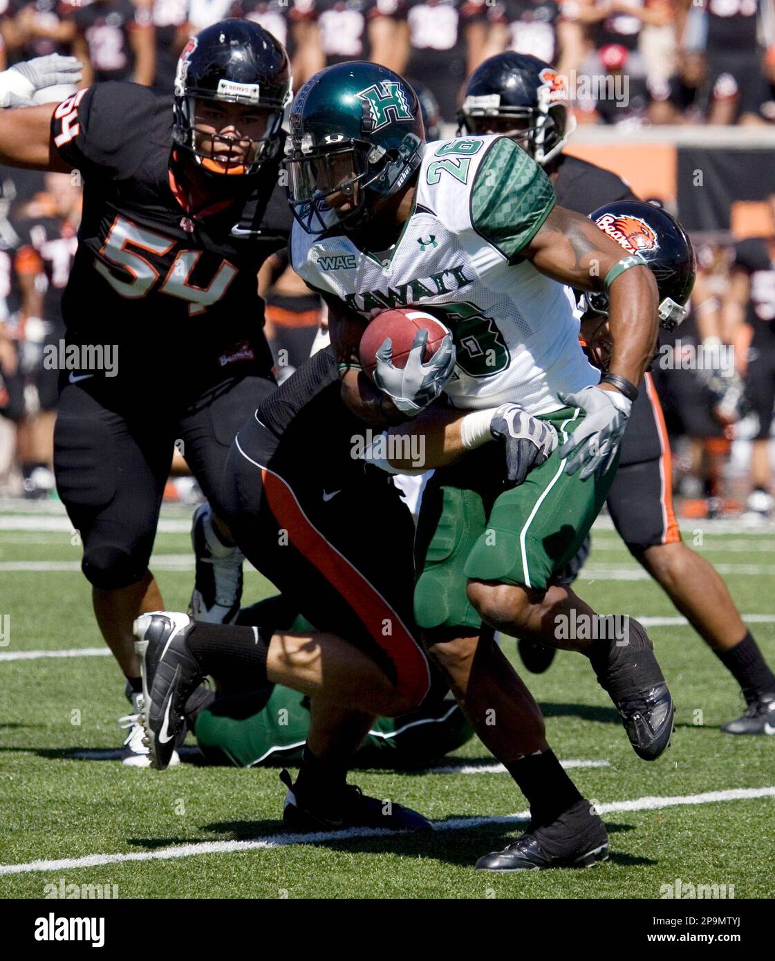Hawaii running back Daniel Lebre, right, runs against Oregon State ...
