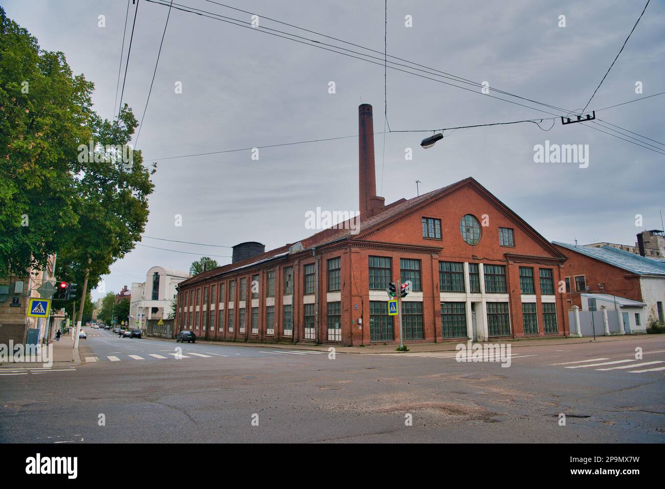 Red brick facade of an old and abandoned factory building in Vyborg ...