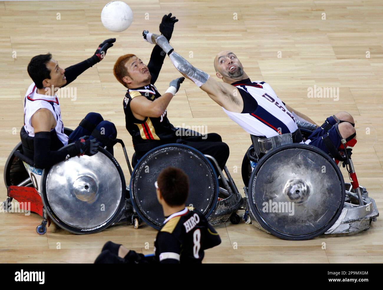 Japan's Manabu Tamura, center, fights United State's Will Groulx, left ...