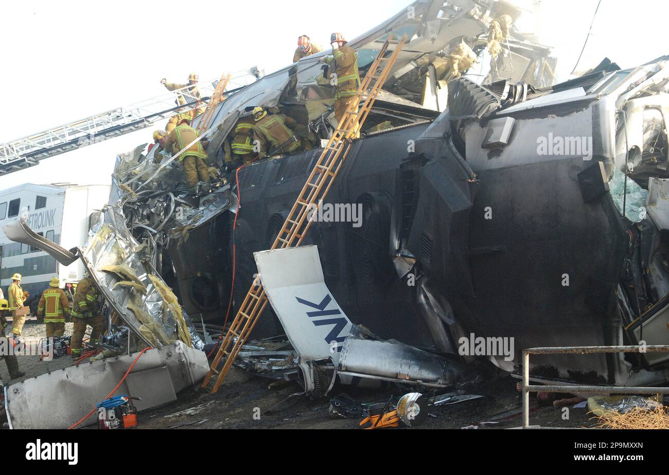 Rescue personnel work at the scene of a train crash in Los Angeles ...
