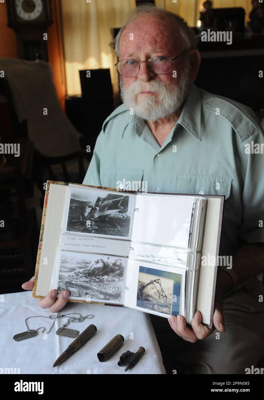 John H. Wilberding, 86, of Shepherd holds photographs on Thursday, Sept ...