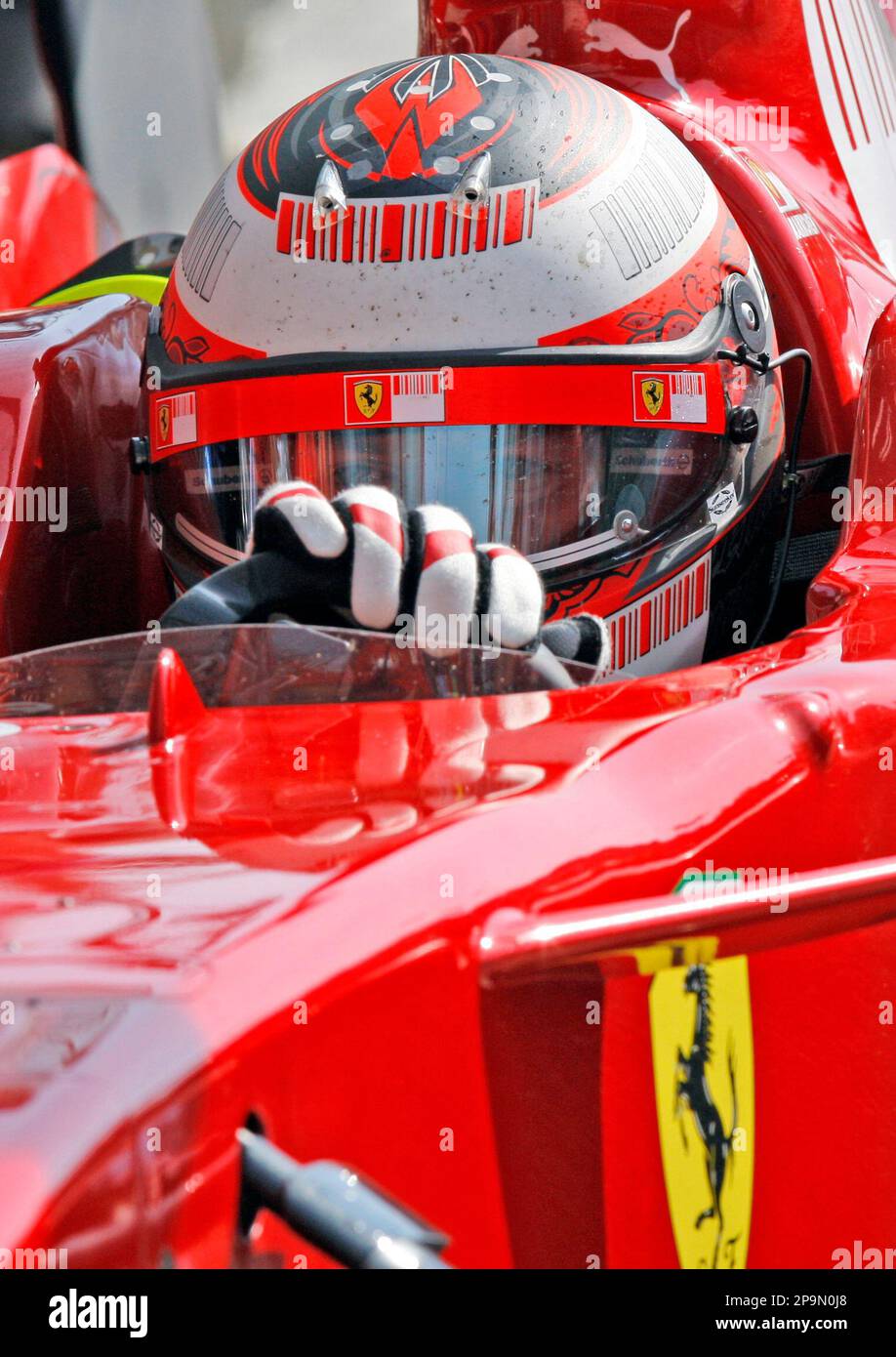 Ferrari Formula One driver Kimi Raikkonen of Finland steers his racer ...