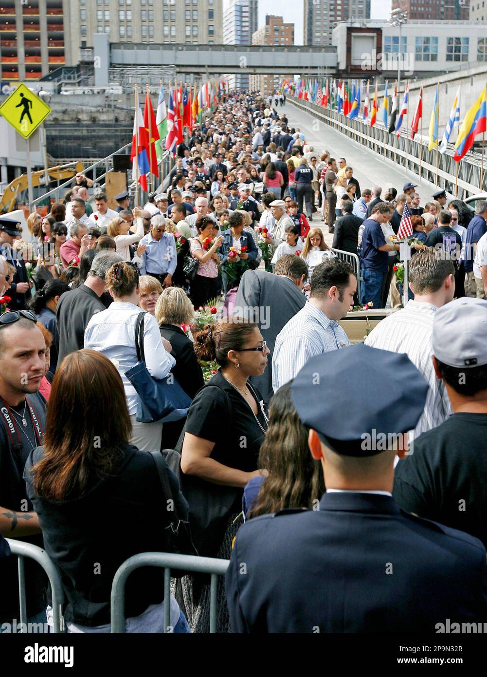 Family members walk down the ramp into ground zero and encircle the ...