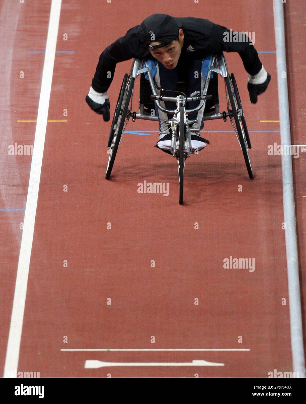 Singapore's Ting Chee Keong Eric competes during the heats of the Men's ...