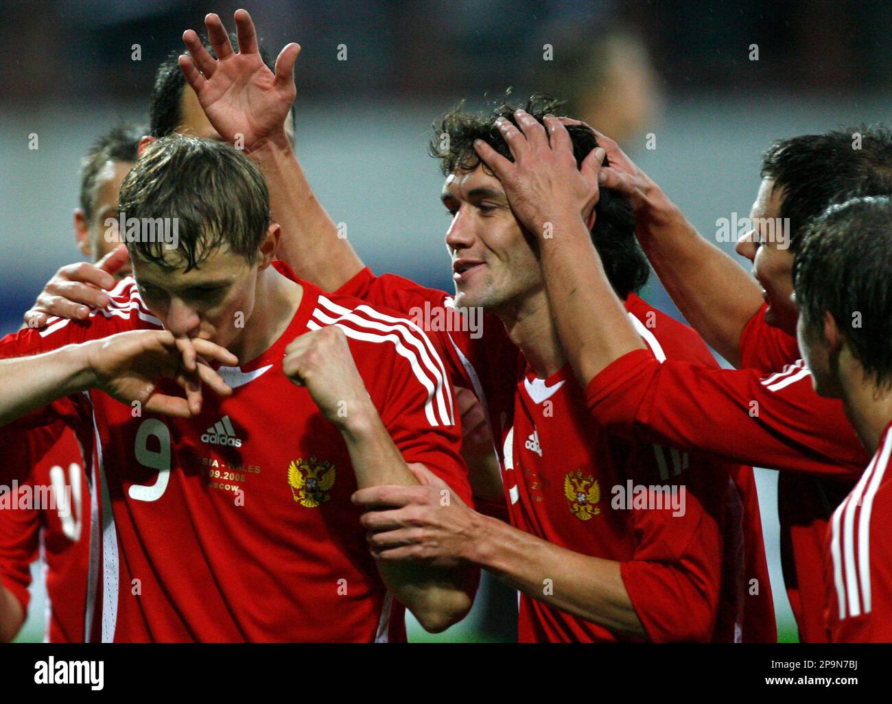 Russia's players congratulate team mate Roman Pavlyuchenko, left, after ...