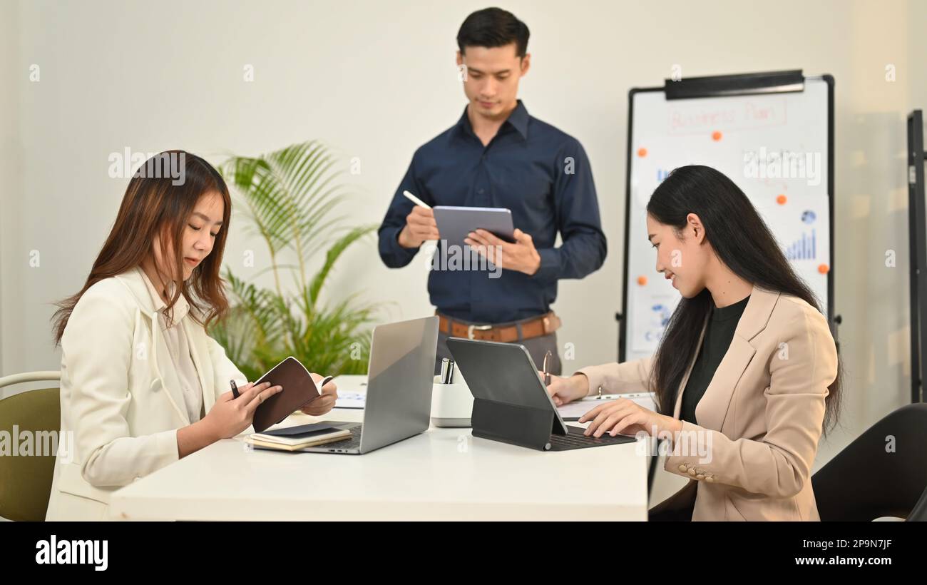 Start up business people discussing over new business project and ...