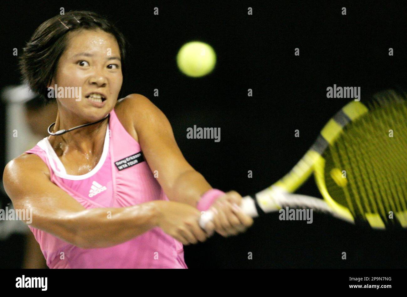 Meng Yuan of China hits a return against Patty Schnyder of Switzerland ...
