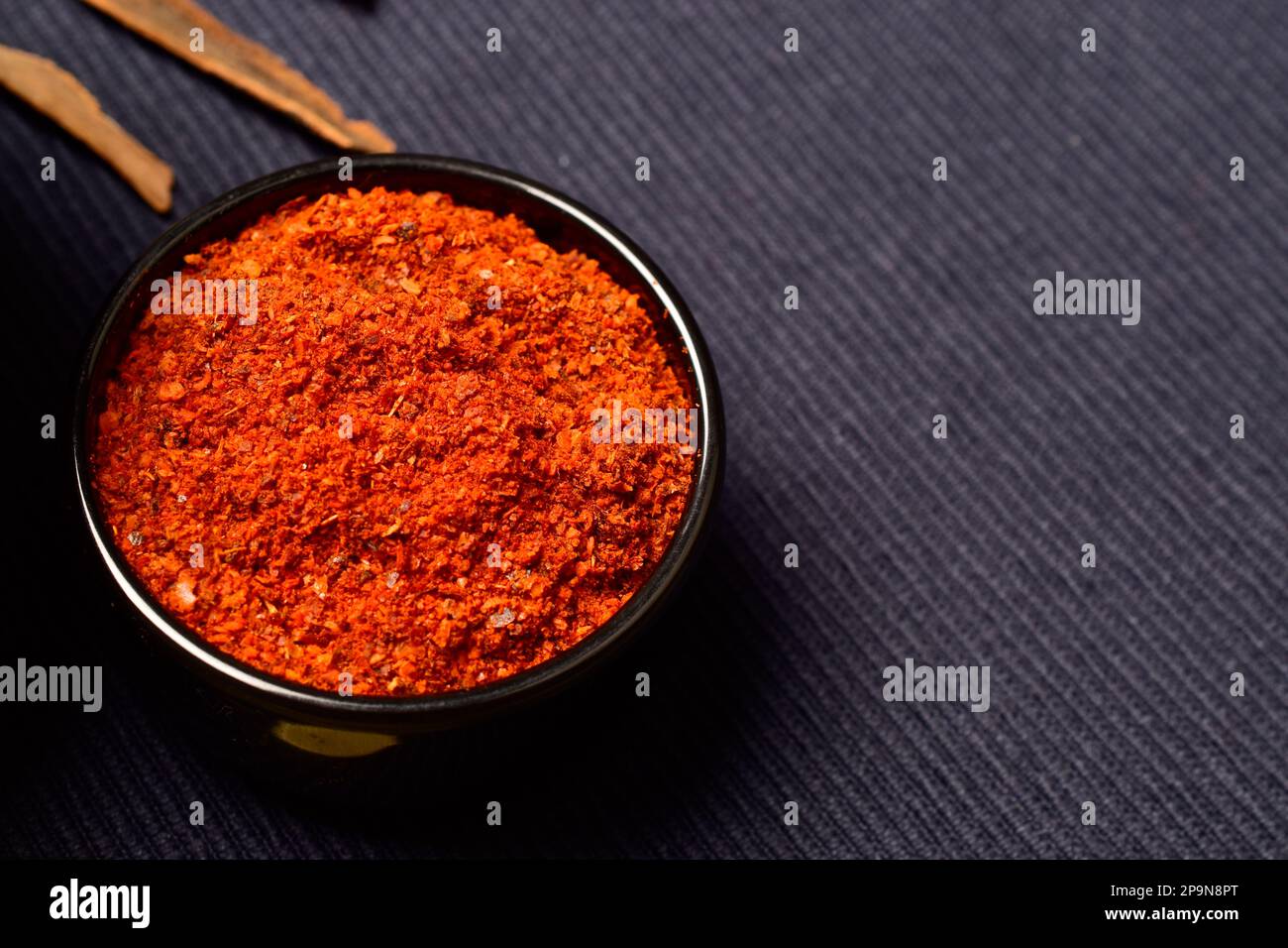 Ground red chilli in bowl, lal mirch powder Stock Photo - Alamy