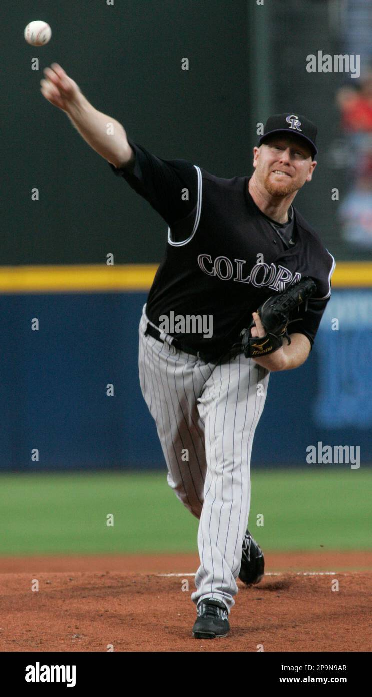 Colorado Rockies pitcher Aaron Cook throws against the Atlanta Braves ...