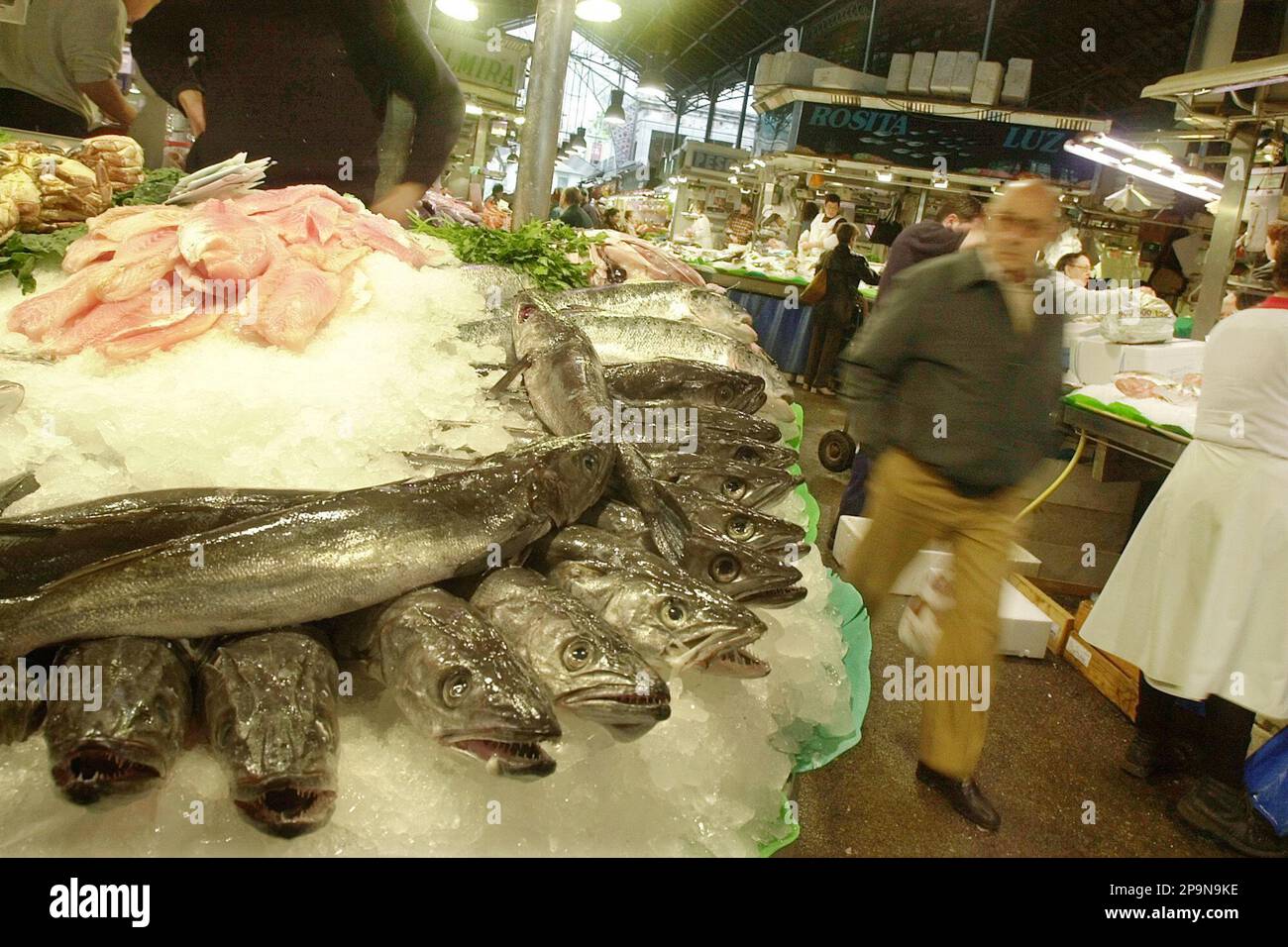 ** FILE ** In this May 7, 2002 file photo, a man strolls past a fish ...