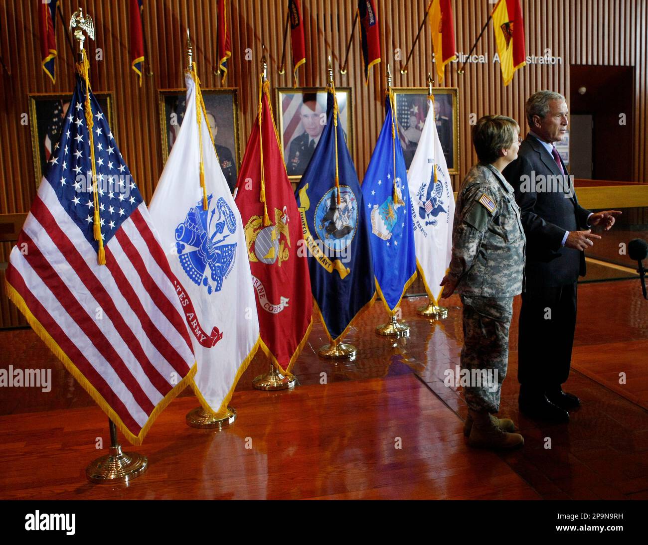 President Bush, right, accompanied by Maj. Gen. Carla G. Hawley-Bowland ...