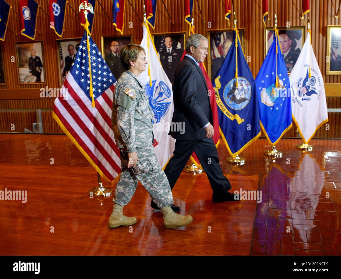 President Bush, right, accompanied by Maj. Gen. Carla G. Hawley-Bowland ...
