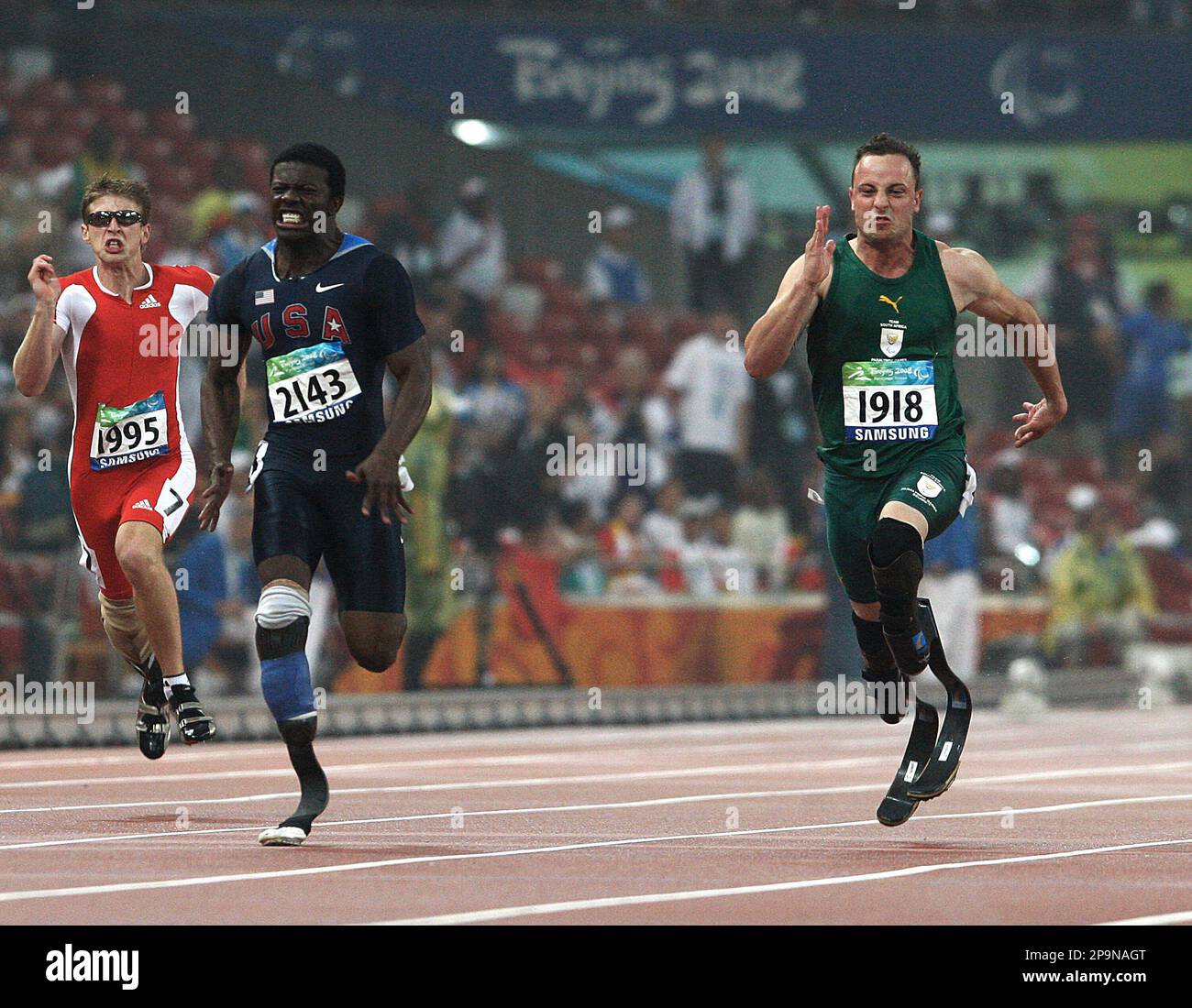 Oscar Pistorius of South Africa, right, Jerome Singleton, center, of ...