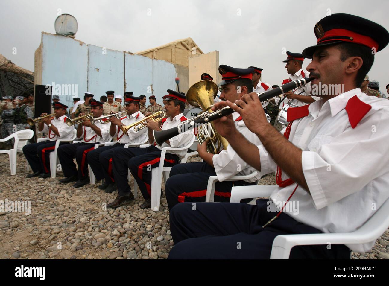 An Iraqi military band performs at a ceremony as the 34th Armored ...