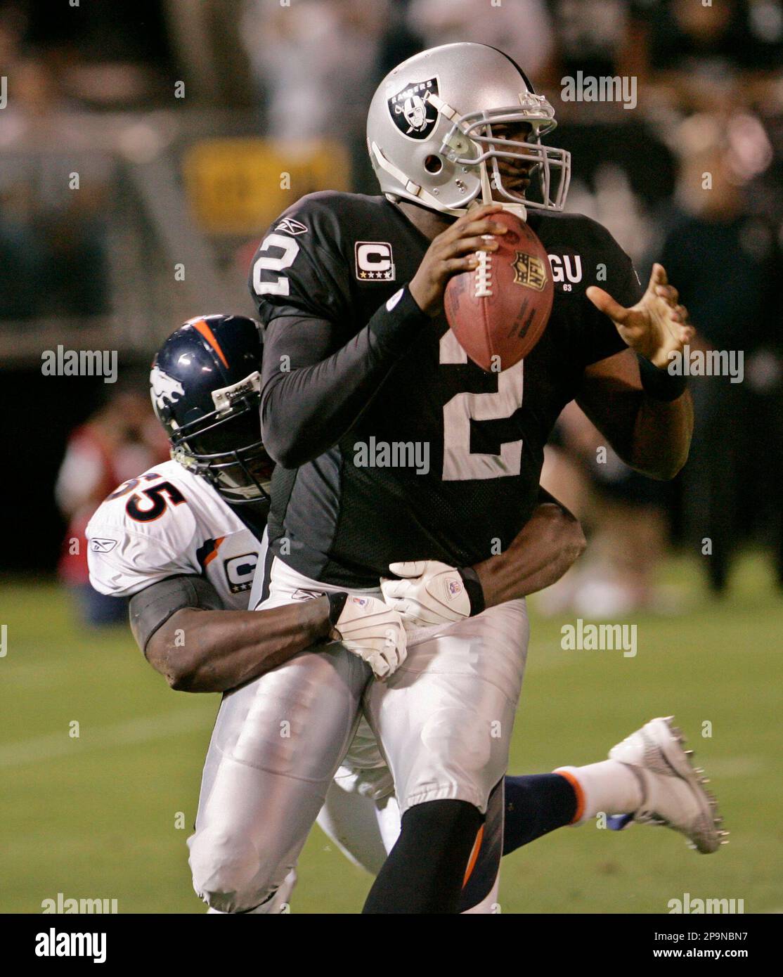 Oakland Raiders quarterback JaMarcus Russell (2) is sacked by Denver ...