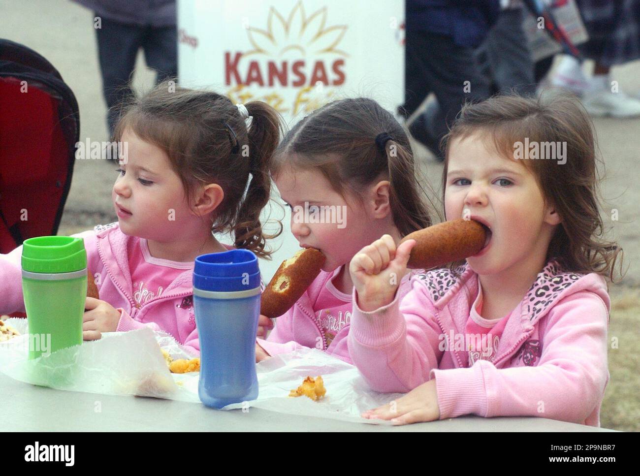 Hoisington triplets Hailey, left, Kassy and Lexus Petersilie, 2, eat ...