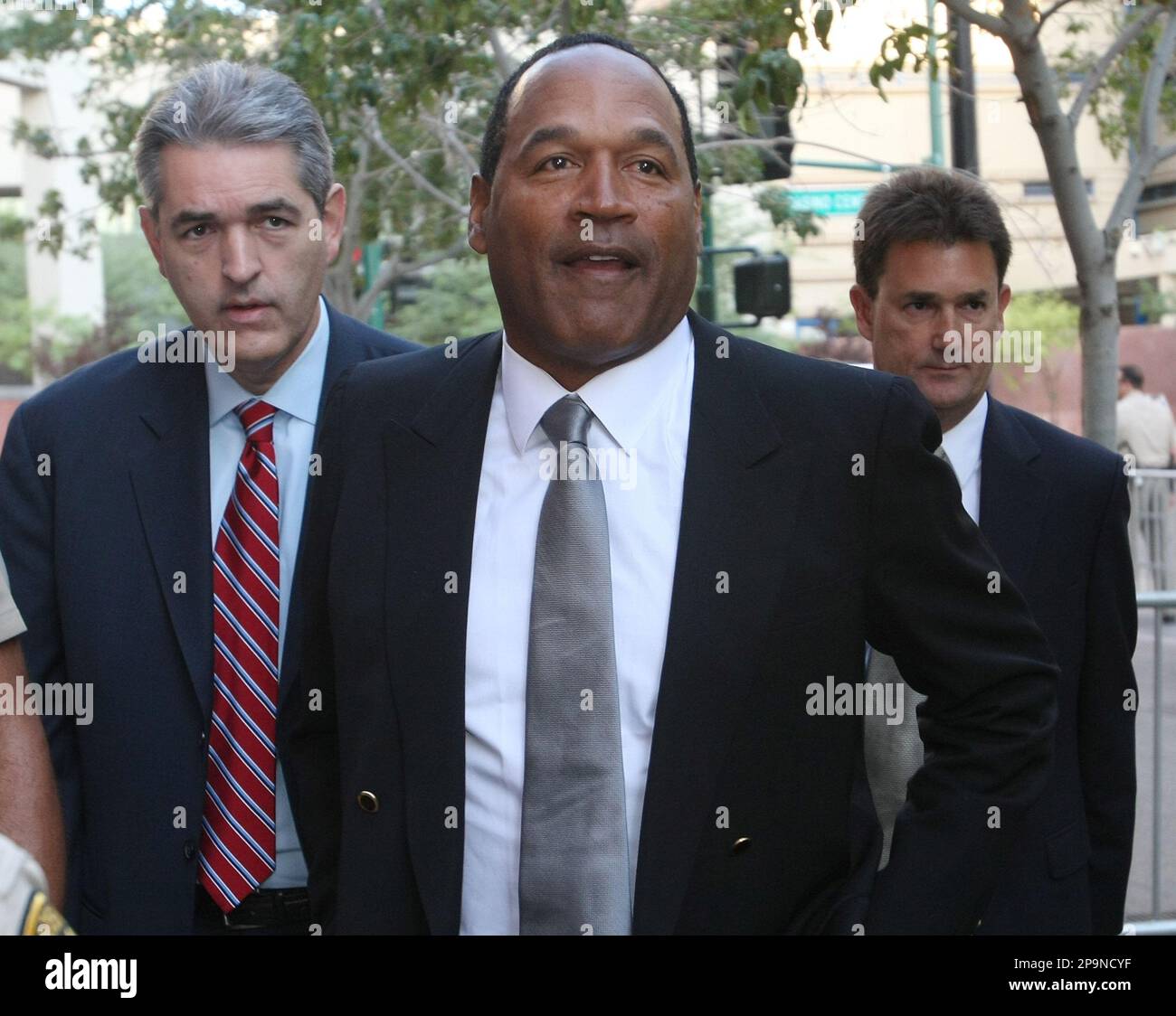 O.J. Simpson, center, and his attorneys Gabriel Grasso , left, and Yale ...