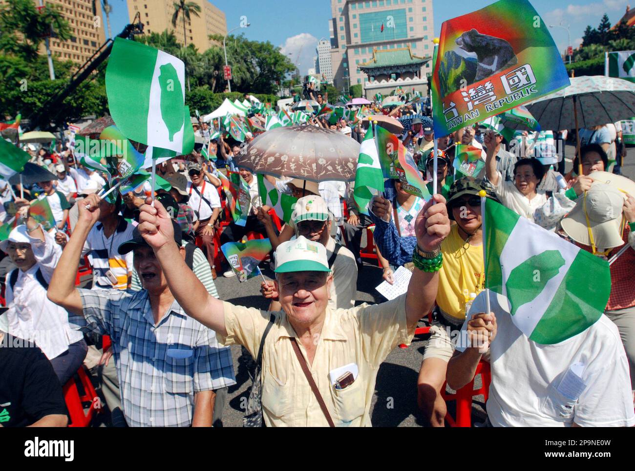 Taiwan demonstrators raise flags of "Taiwan Republic" during a flag ...