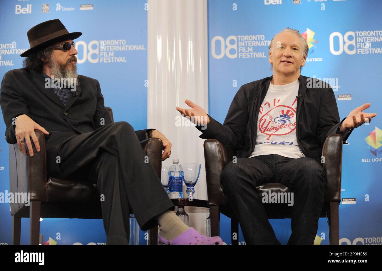 Director Larry Charles, left, and television personality Bill Maher ...