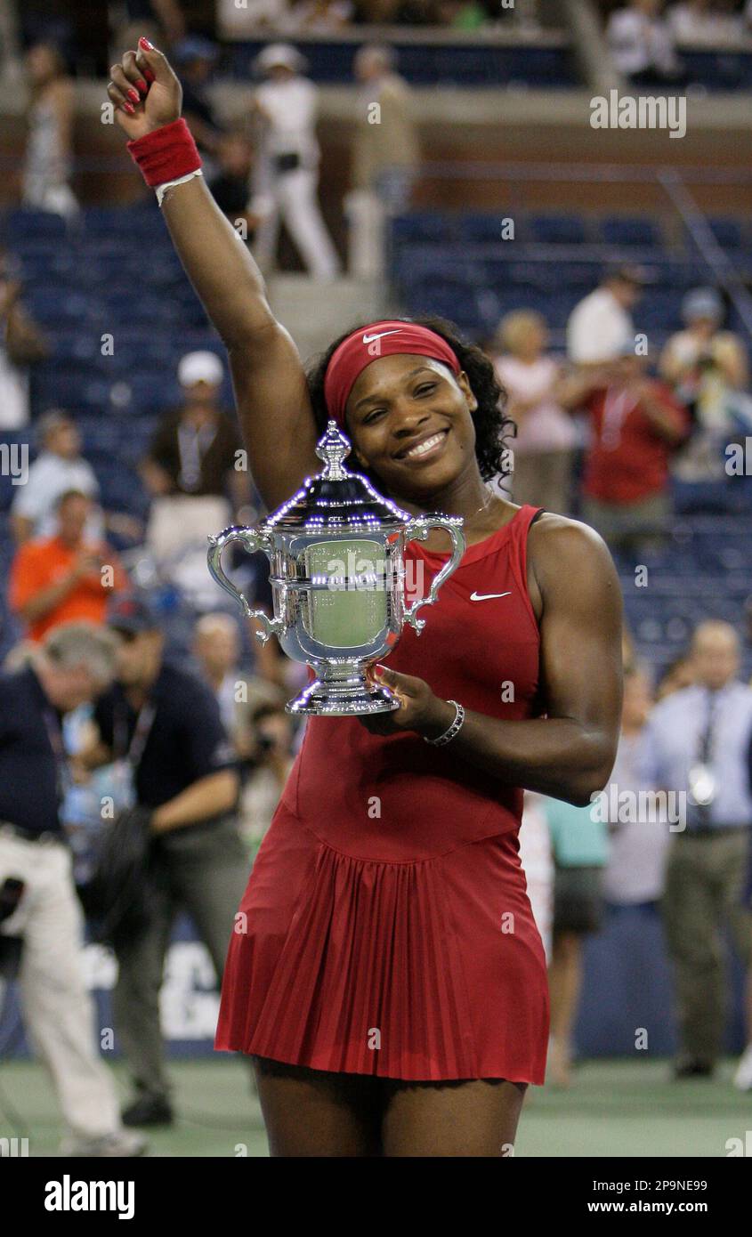 Serena Williams, of the United States, poses with her championship ...