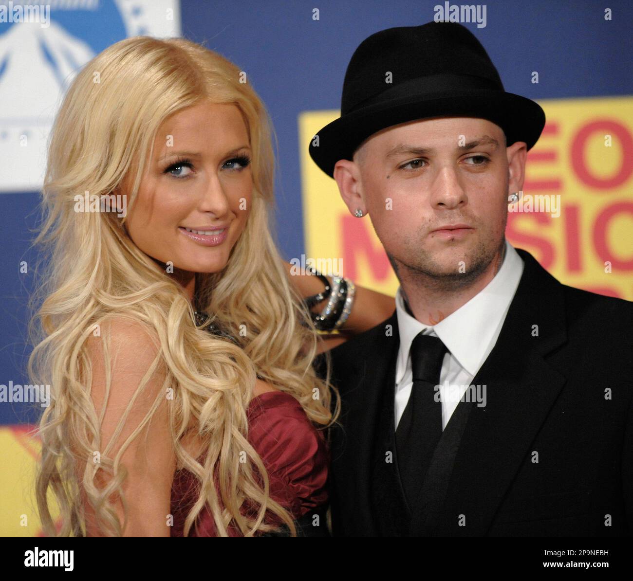 Paris Hilton and her boyfriend, musician Benji Madden pose backstage at ...