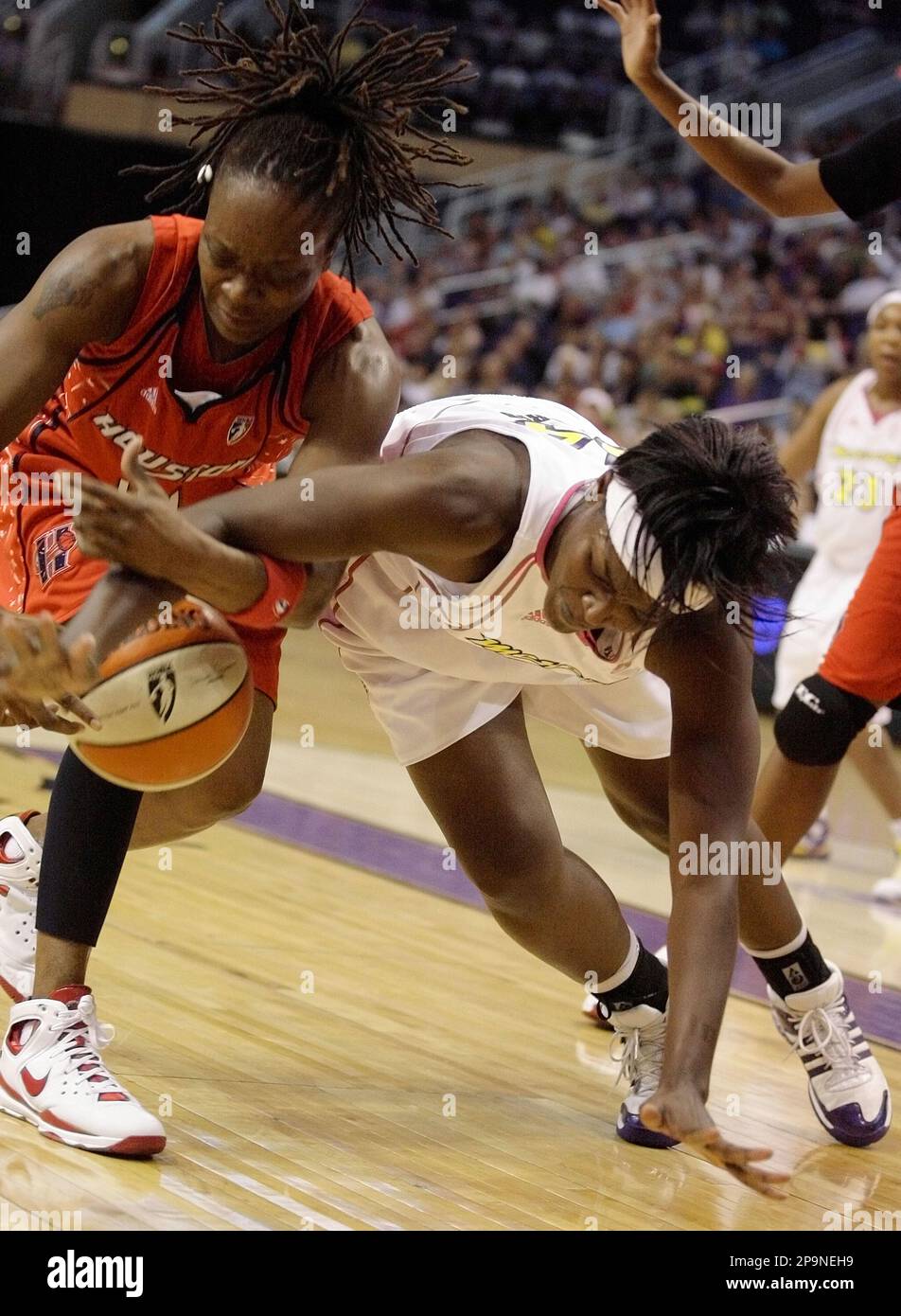 Houston Comets guard Shannon Johnson, left, and Phoenix Mercury forward ...