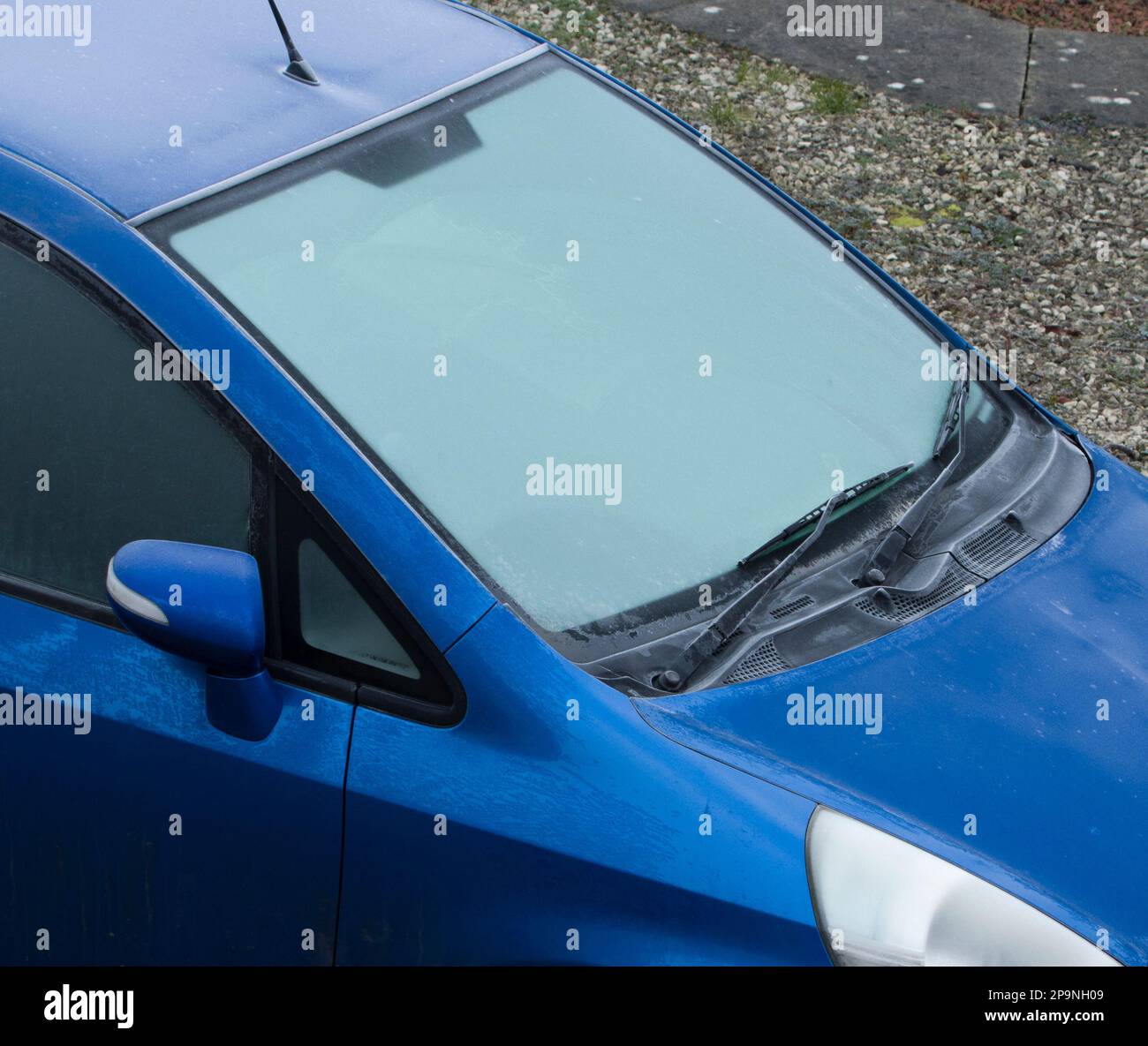 Car Windscreen Covered in Frost Stock Photo - Alamy
