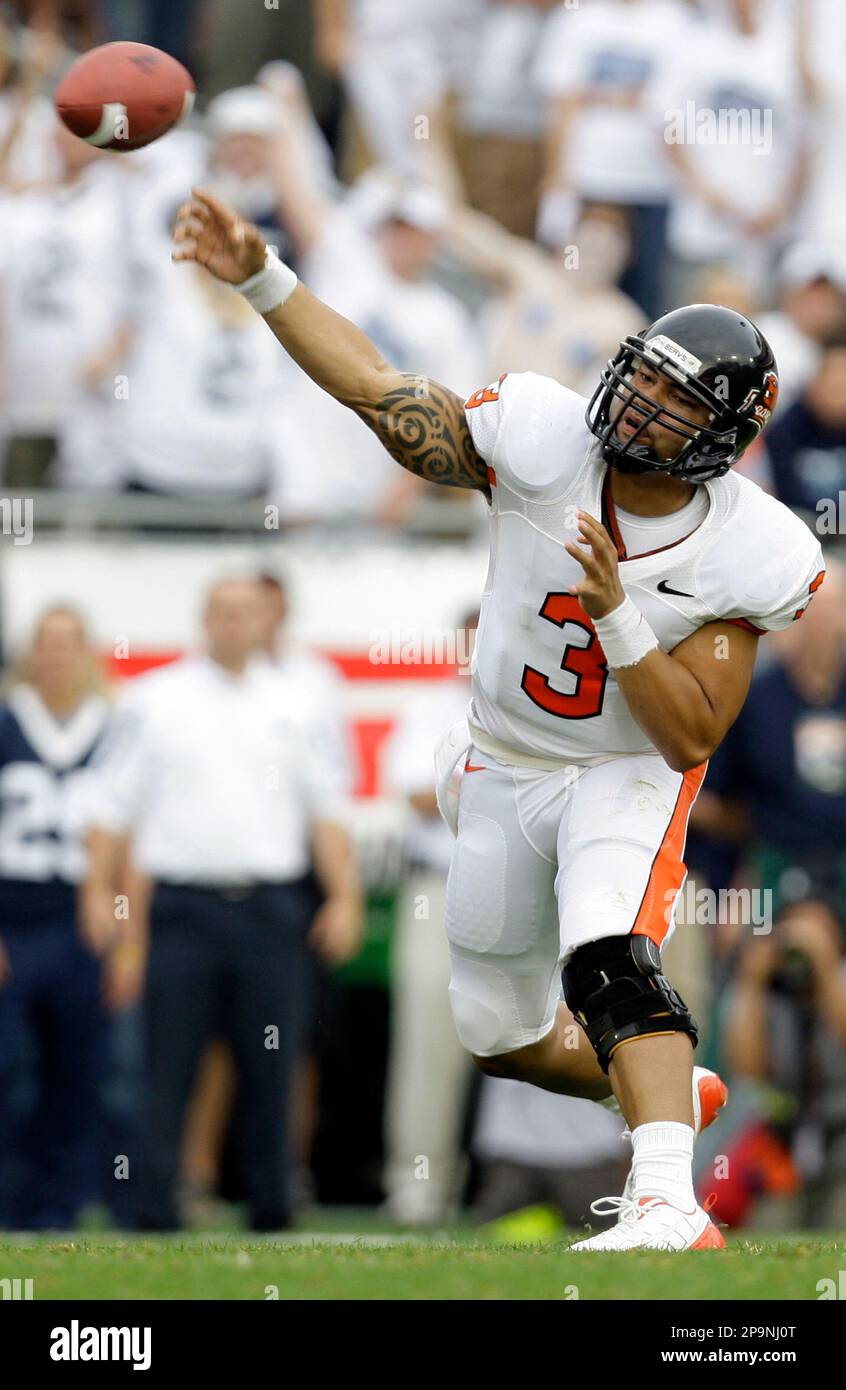 Oregon State quarterback Lyle Moevao throws the ball during the second ...