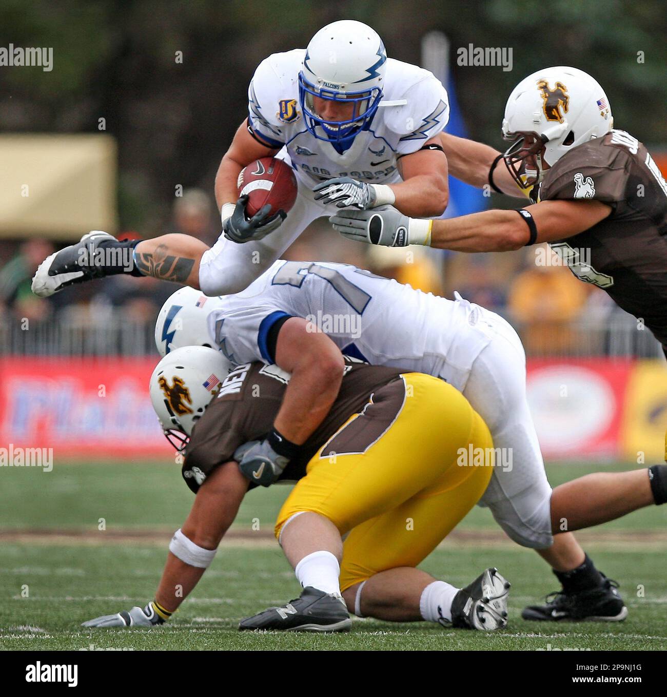 Air Force fullback Todd Newell jumps to get a first down against the ...
