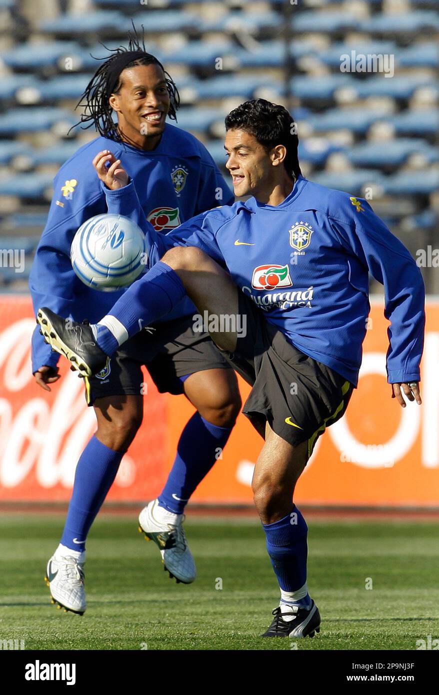 Brazil's soccer players Josue, right, and Ronaldinho train with their ...