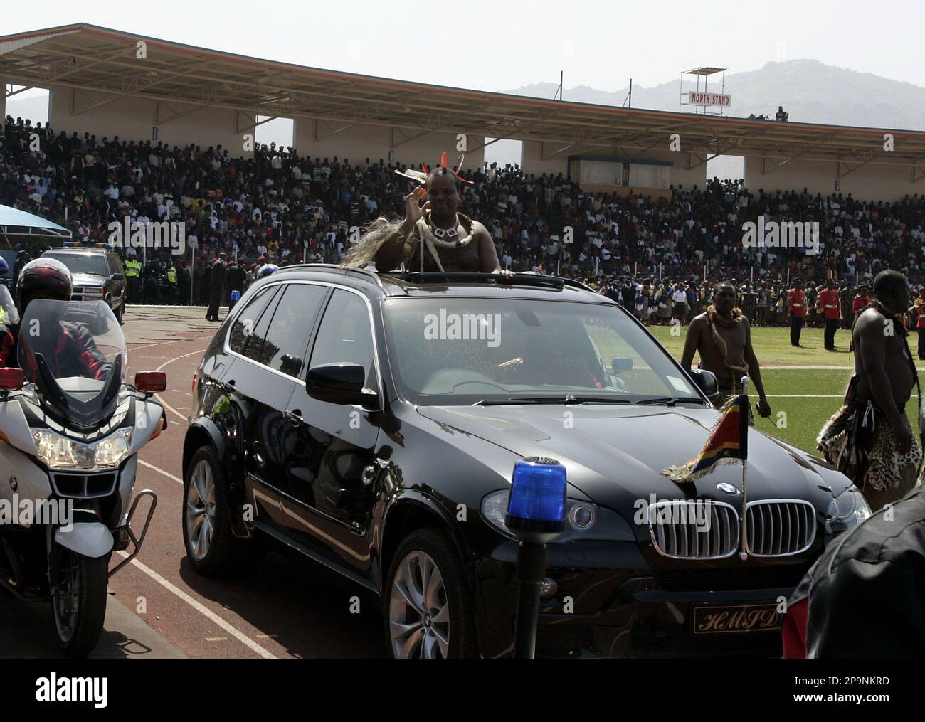 Swaziland King Mswati III, center, wave during his birthday ...